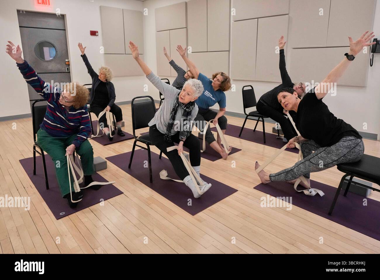 Whitney Chapman, right, conducts a chair yoga class at the Marlene ...