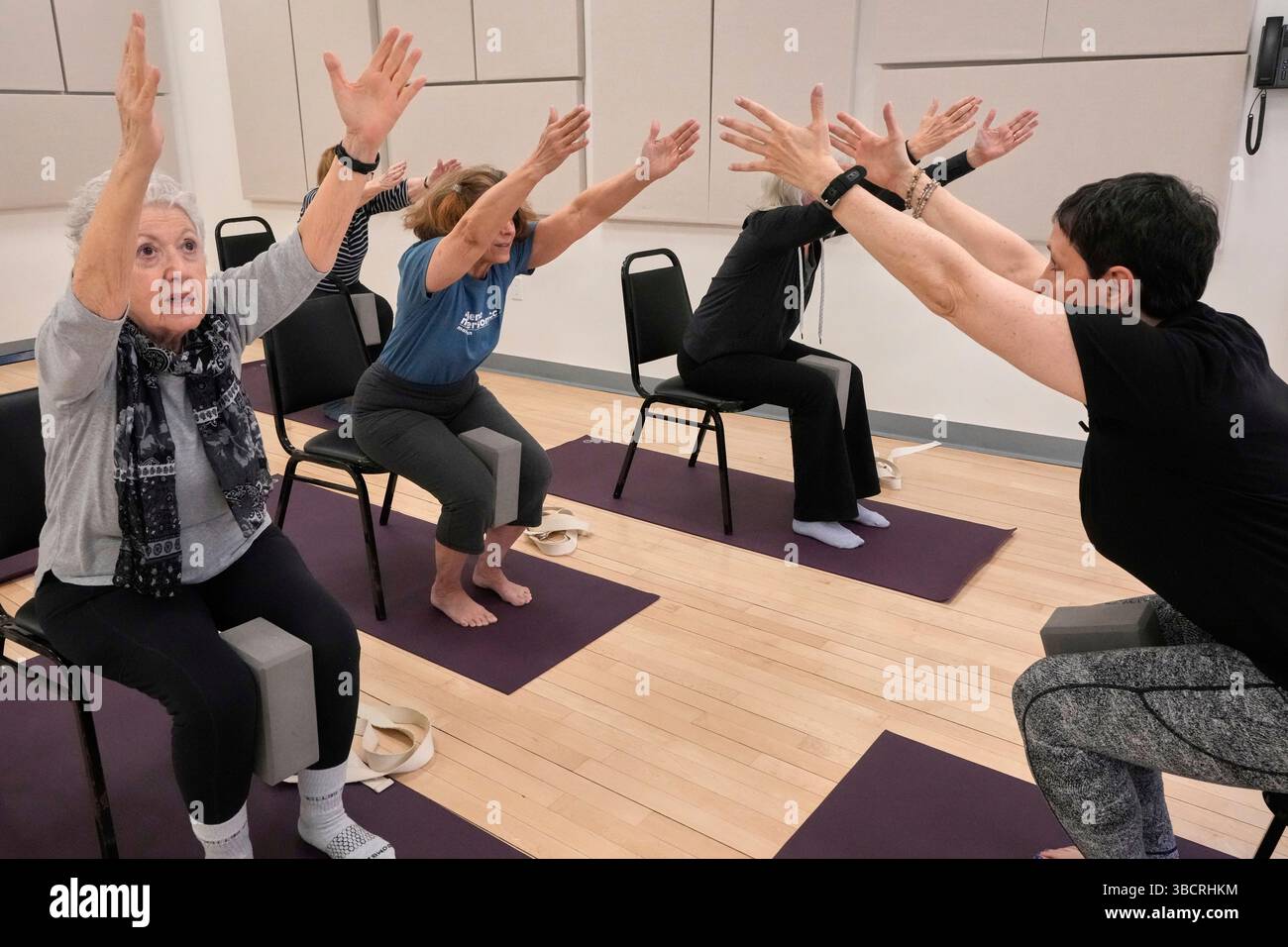 Whitney Chapman, right, conducts a chair yoga class at the Marlene ...
