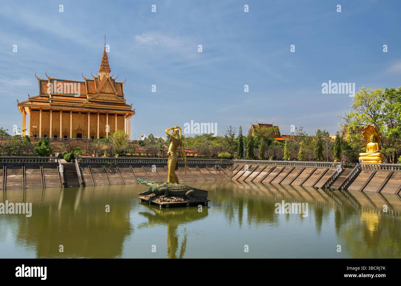 The landscaped reservoir with statues and temple view at Udon Monastery ...