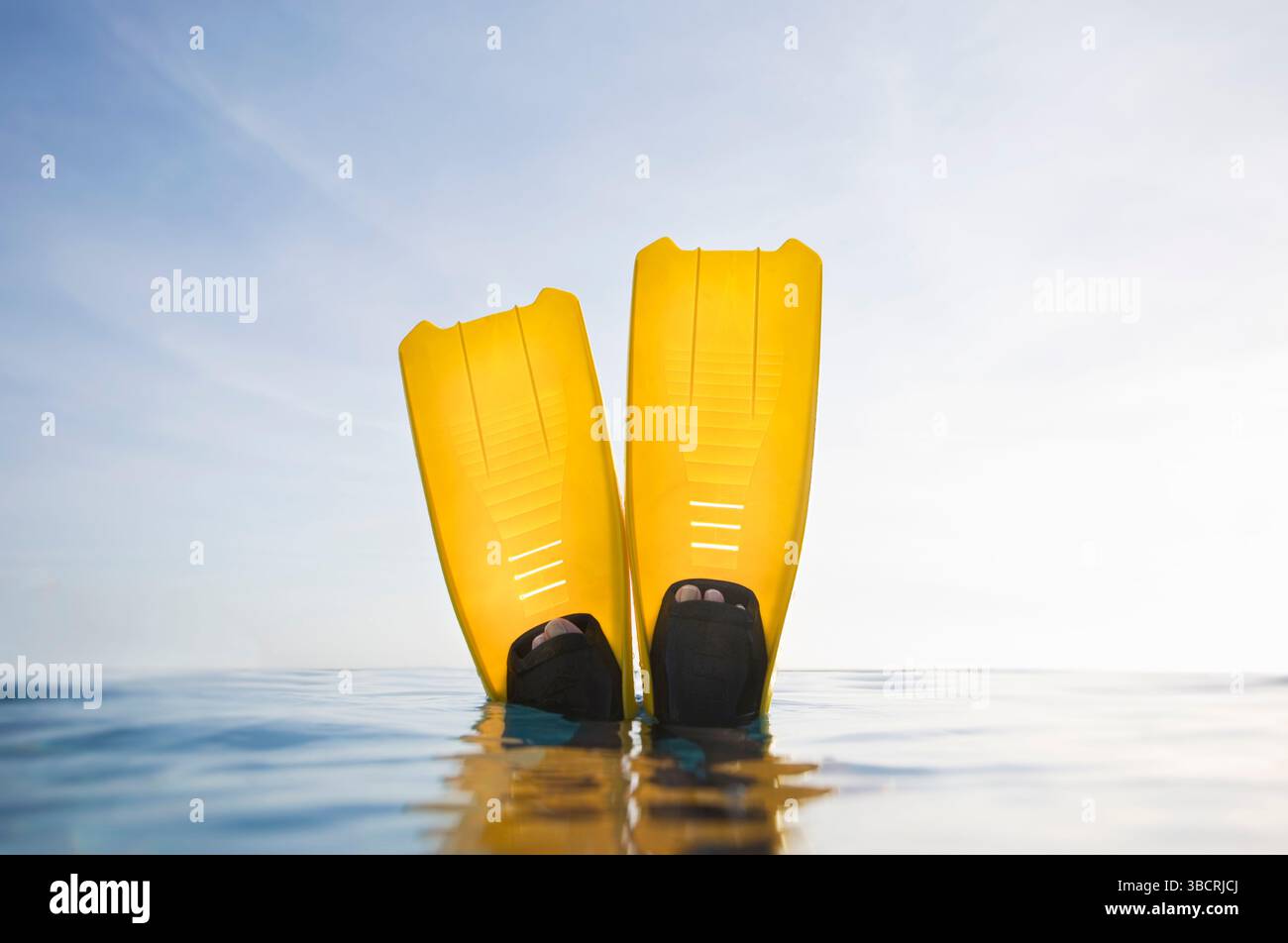 Woman in yellow flippers swimming hi-res stock photography and images ...