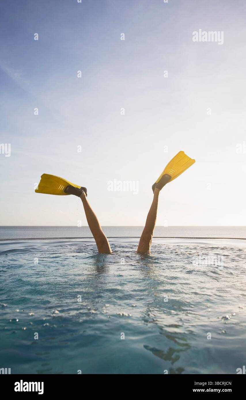 Woman in yellow flippers swimming hi-res stock photography and images ...