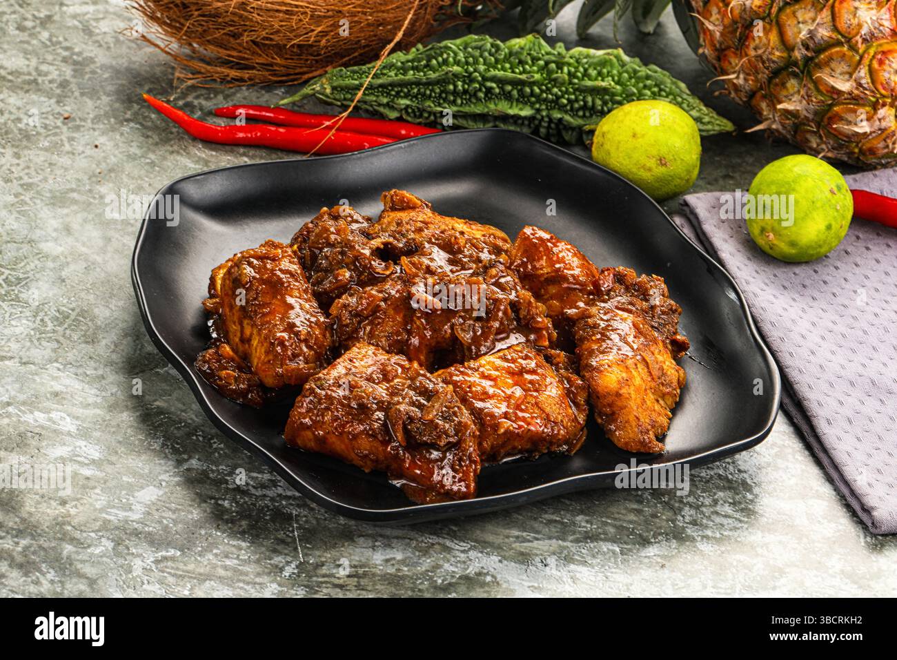 Indian cuisine - Vindaloo fish with spices and garnish Stock Photo - Alamy