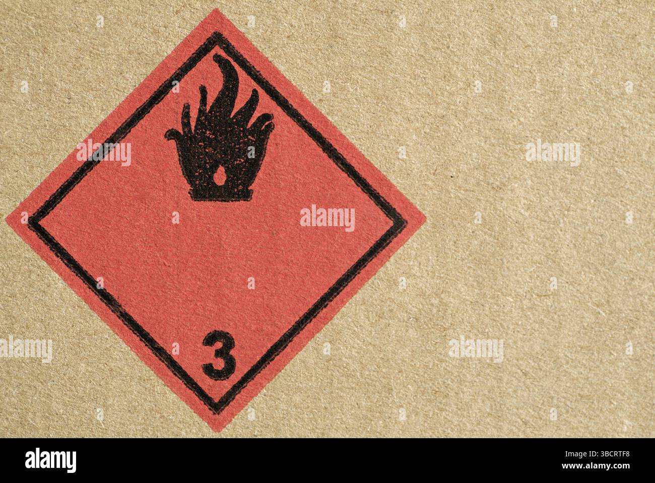 Fire hazard warning sign on a cardboard box Stock Photo - Alamy