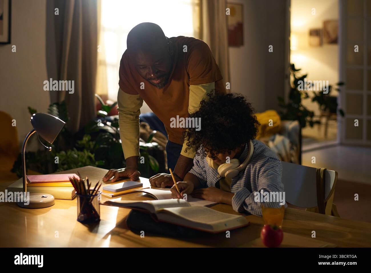 Help study kid warm hi-res stock photography and images - Alamy
