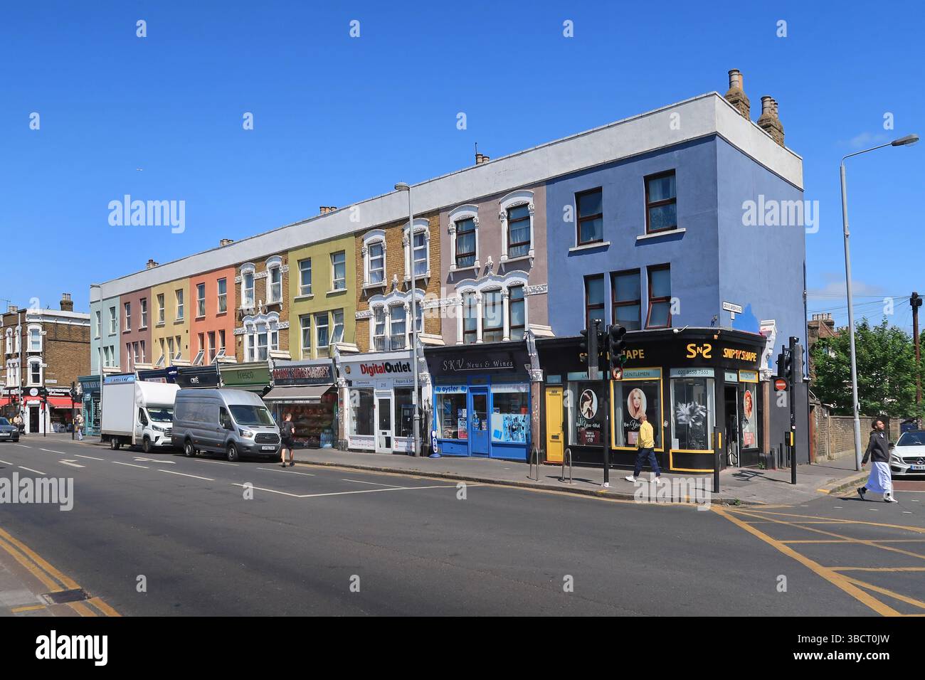 Multi-coloured of shops on High Road Leyton, London, UK. Shows Nos 206 ...
