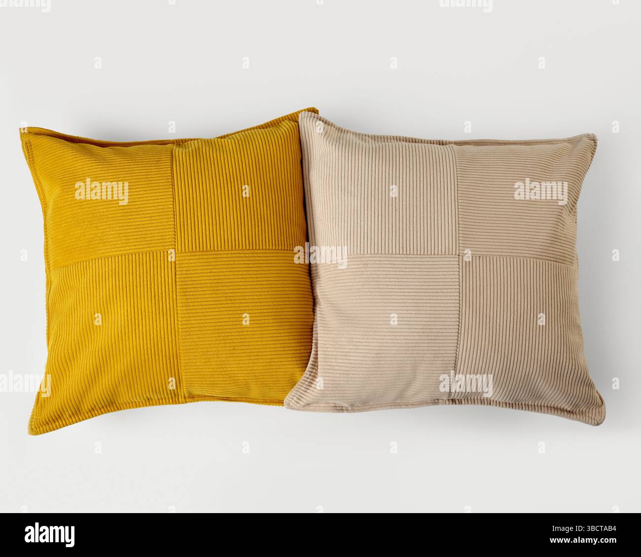 Two decorative pillows lying on white background Stock Photo - Alamy