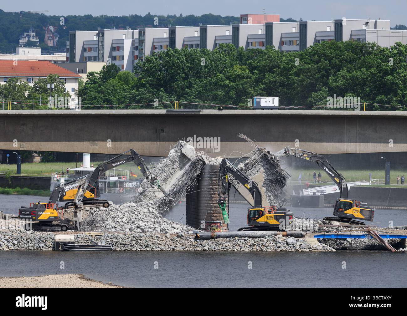 Dresden, Germany. 21st May, 2025. Excavators are used to demolish the ...