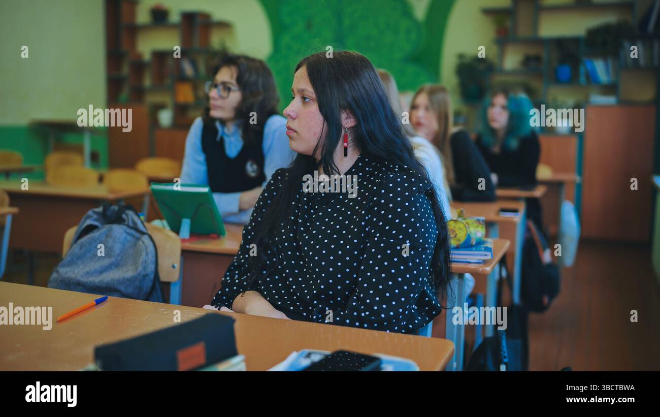 High school students are engaged in active listening during a classroom ...