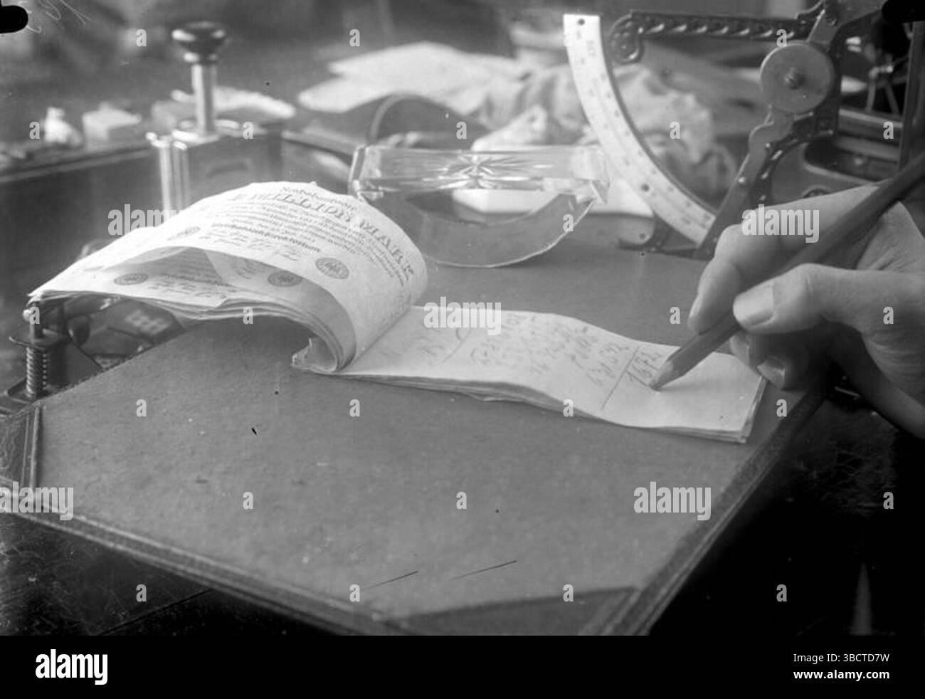 Using million mark notes as a notepad. Hyperinflation affected the ...