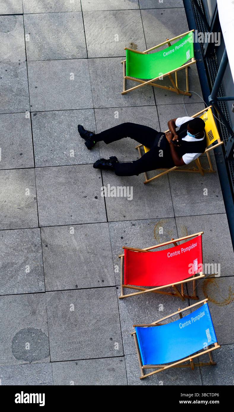 Man sitting on a transat in the Pompidou Center, Paris, France Stock ...