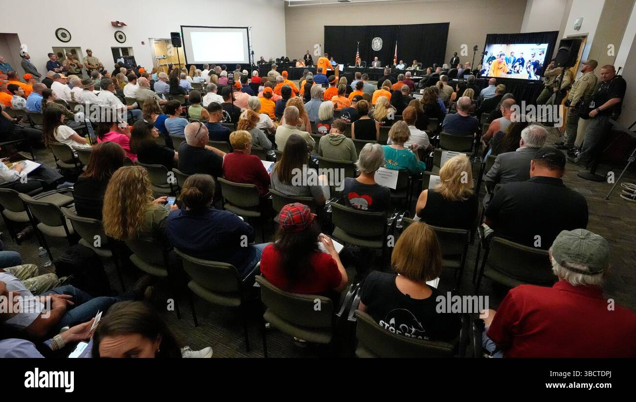 An overflow crowd fills the room at a Florida Fish & Wildlife ...