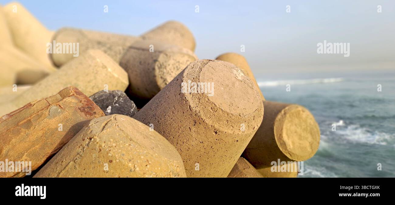 Close-up of concrete tetrapods forming a breakwater, reducing coastal ...