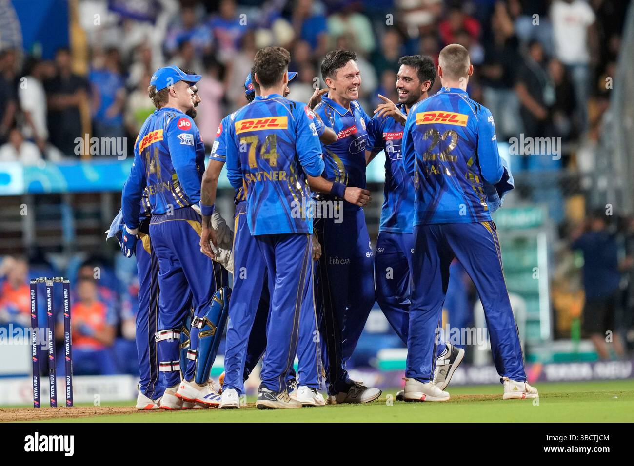 Mumbai Indians' Trent Boult, center, celebrates with teammates after ...