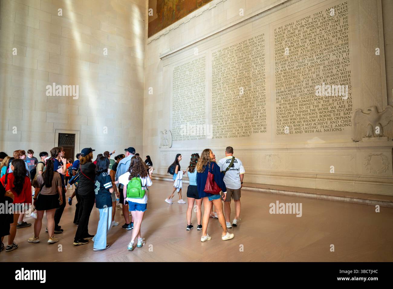 WASHINGTON DC — Visitors observe the engraved text of Abraham Lincoln's ...