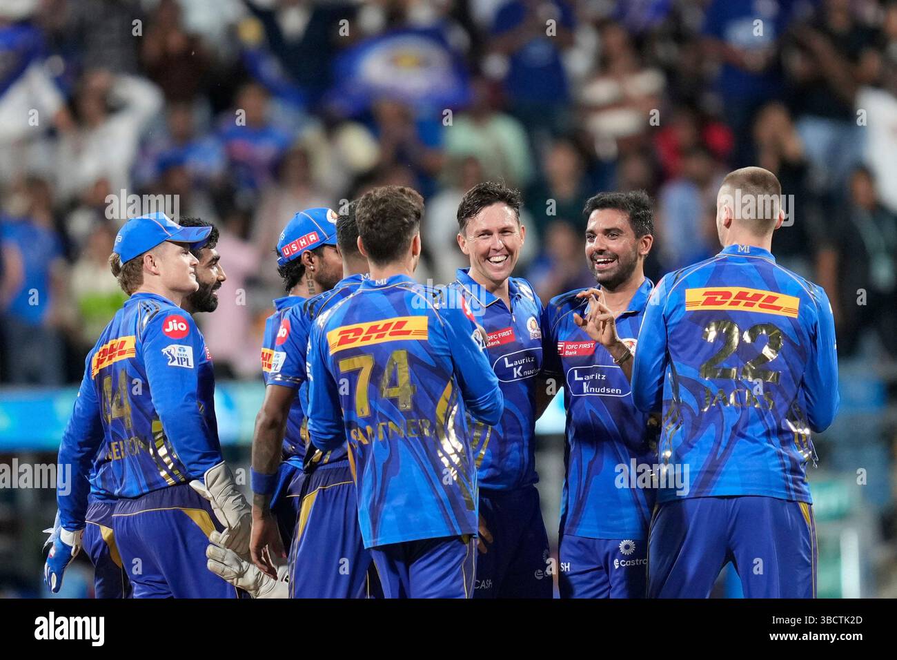 Mumbai Indians' Trent Boult, center, celebrates with teammates after ...