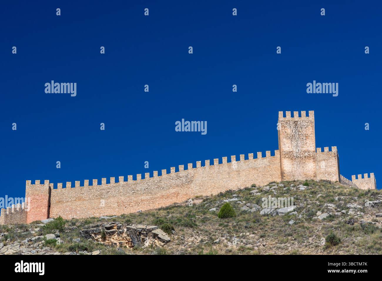 Photograph of the medieval fortress's crenellated stone walls and tower ...