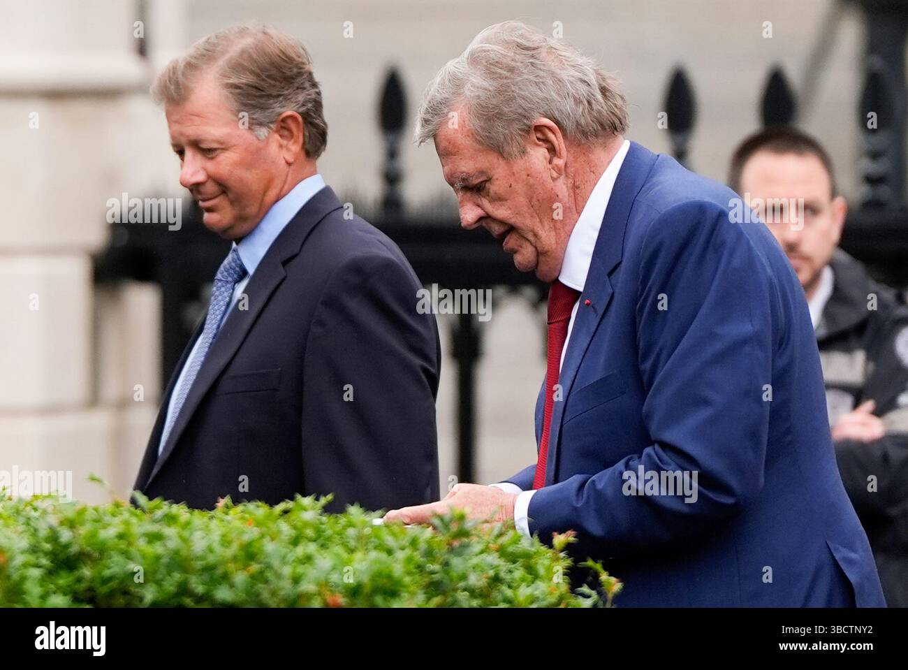 Johann Rupert, right, walks to the Oval Office of the White House ahead ...
