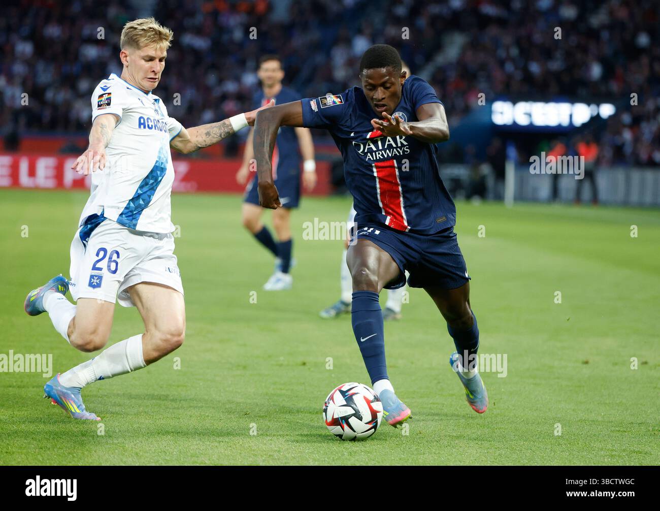 Paris, France. 18th May, 2025. Nuno Mendes of PSG, left Paul Joly of ...