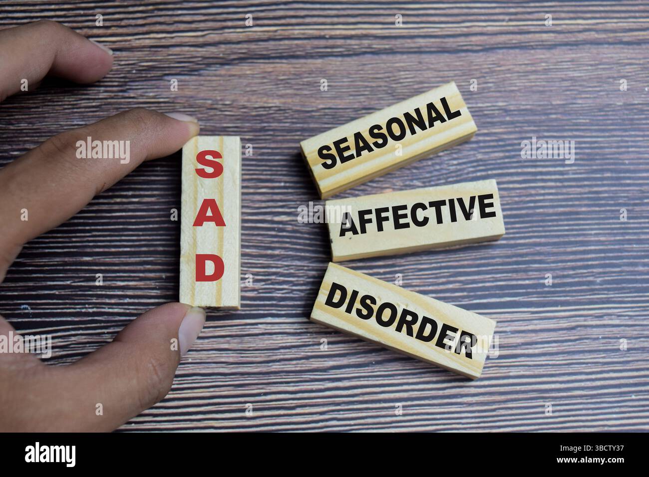 Concept of SAD - seasonal affective disorder Symbol. Wooden block with ...