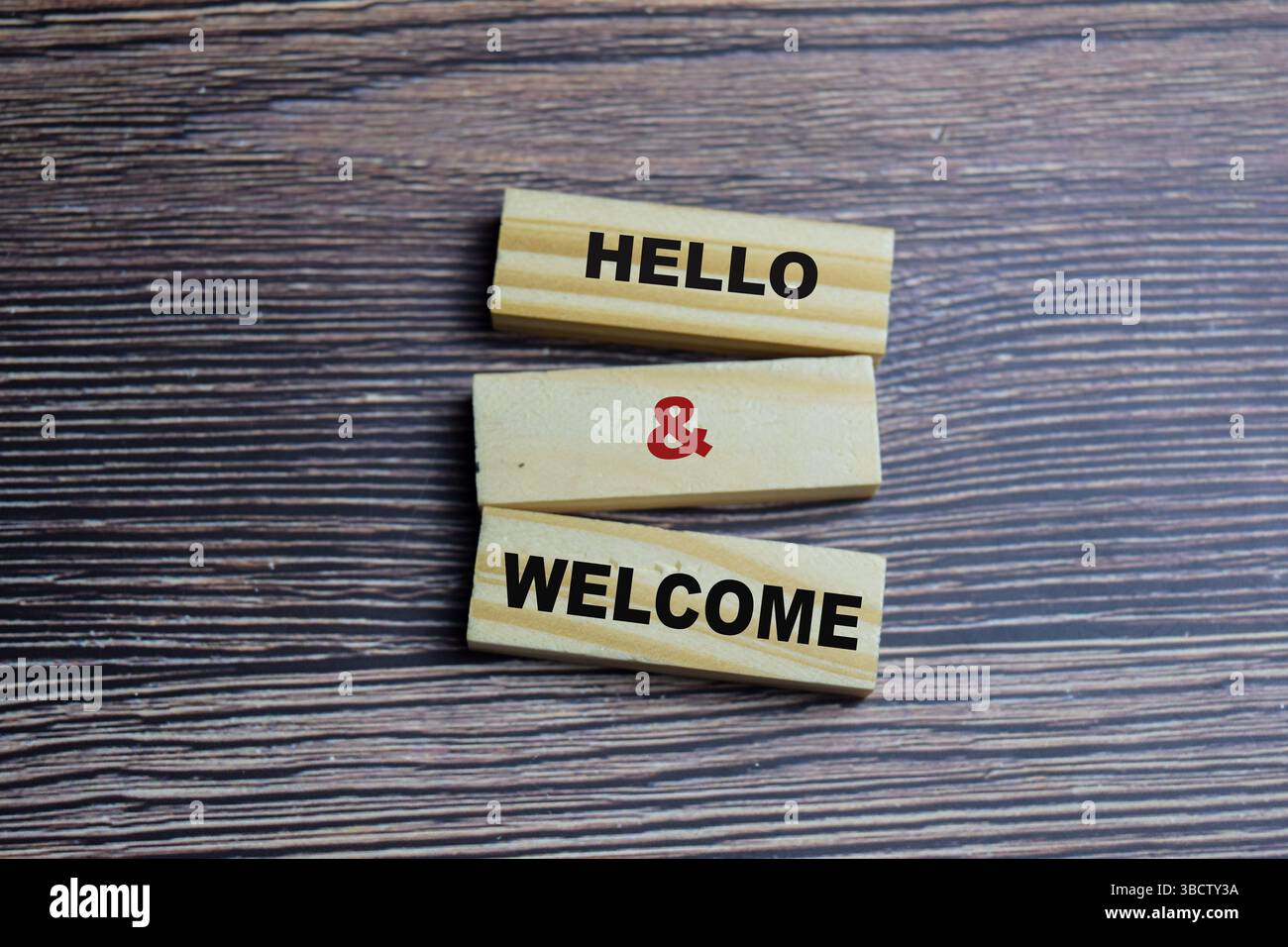 Concept of Hello and welcome Symbol. Wooden block with words Hello and ...
