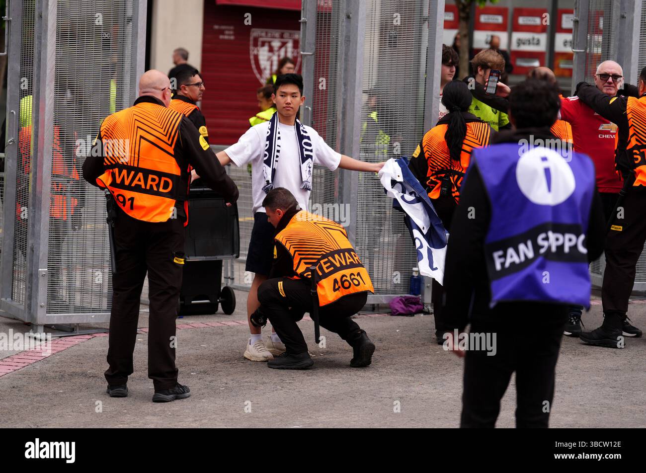Tottenham Hotspur fans make their way through security gates ahead of ...