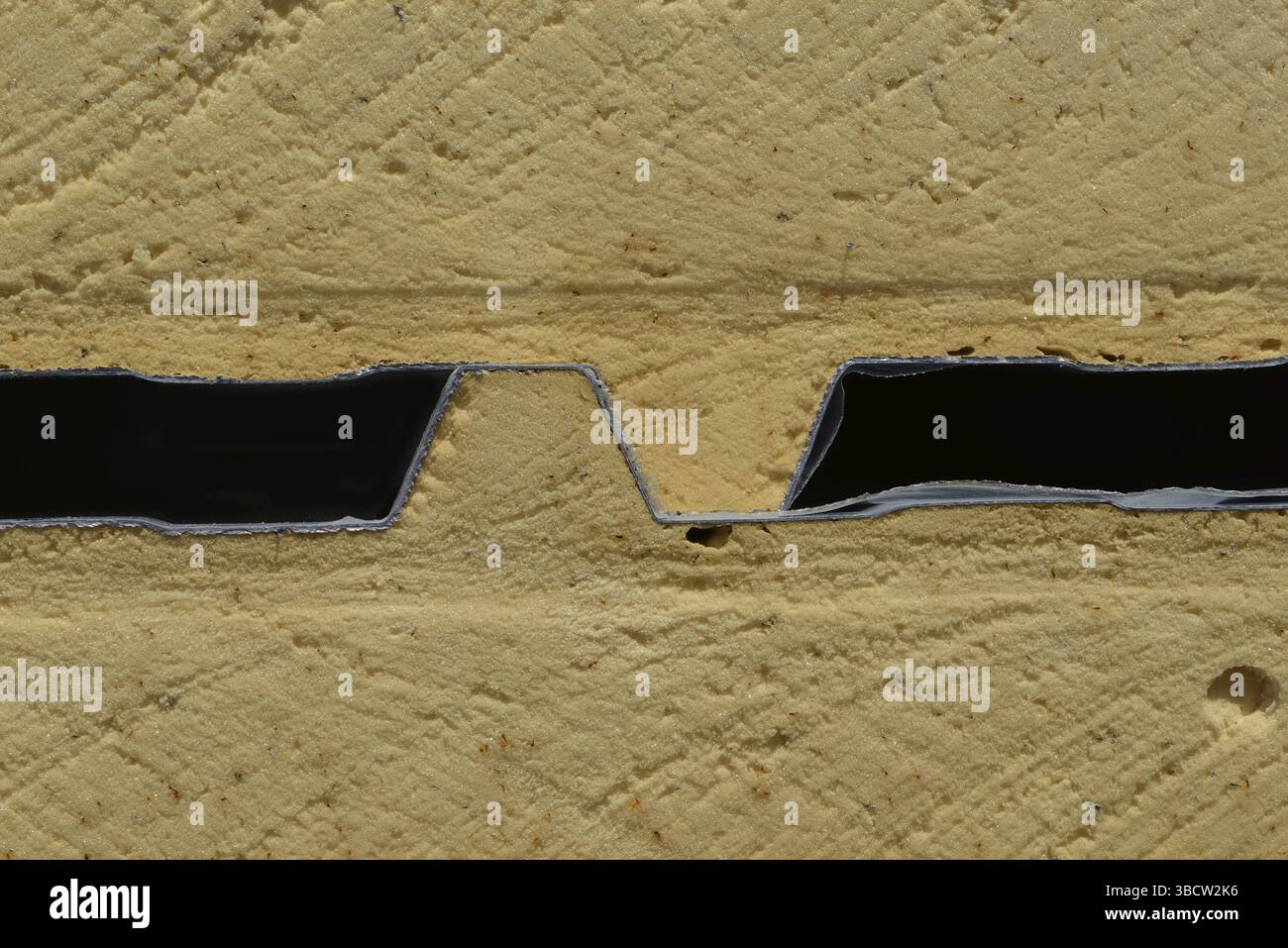 Background of plastic foam cladding on a building site. sandwiched ...