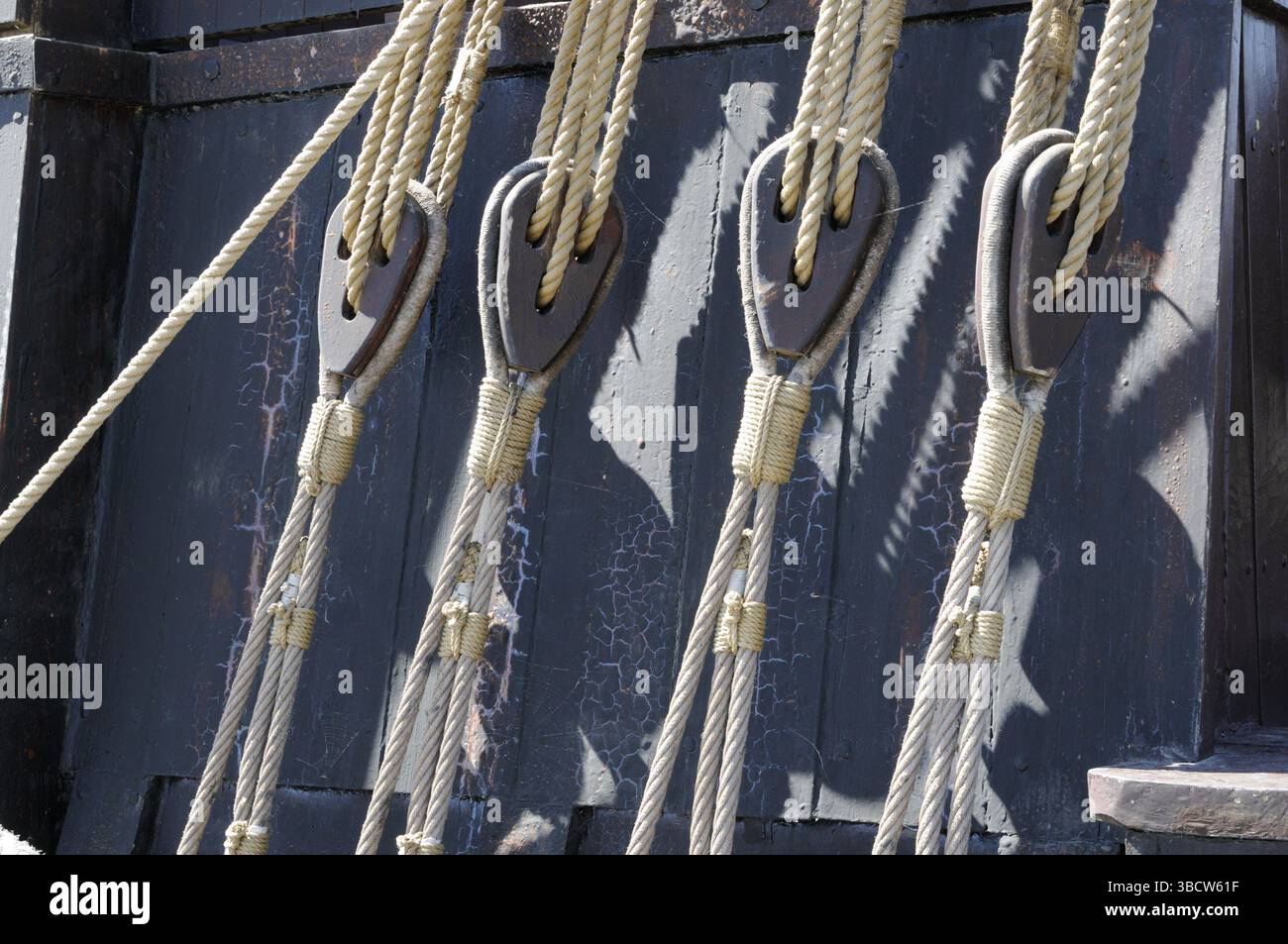 Ropes and pulleys on a ship Stock Photo - Alamy