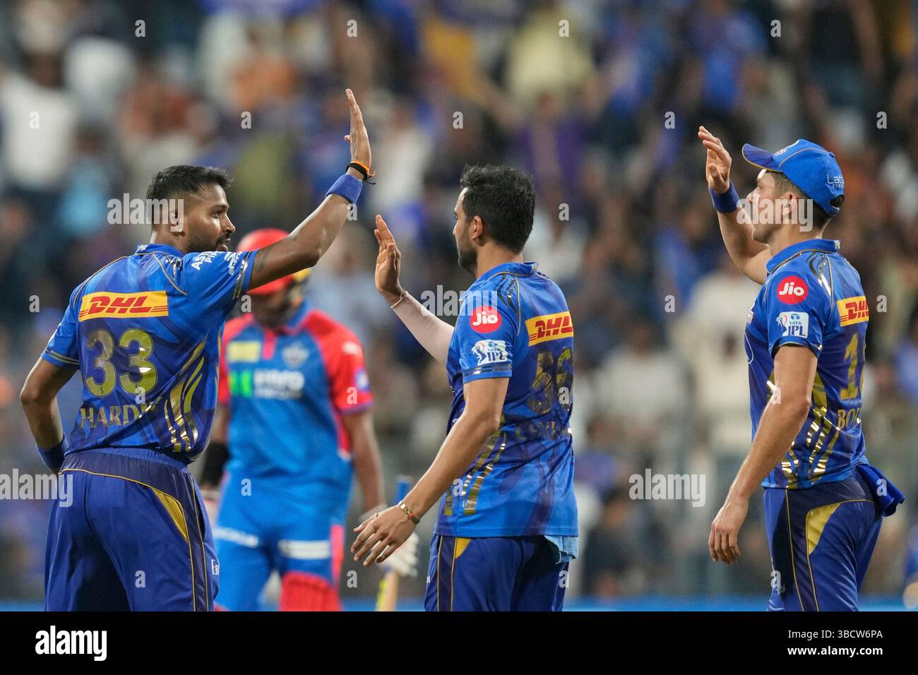 Mumbai Indians' captain Hardik Pandya, left, Deepak Chahar, second right, and Trent Boult, right ...