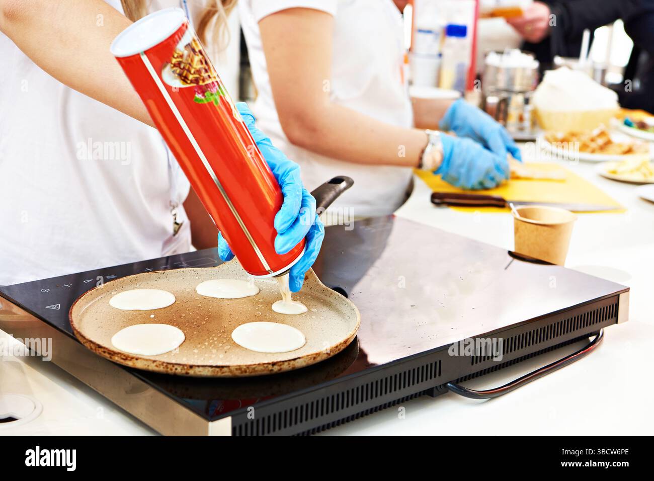 Woman making pancakes in frying hi-res stock photography and images - Alamy