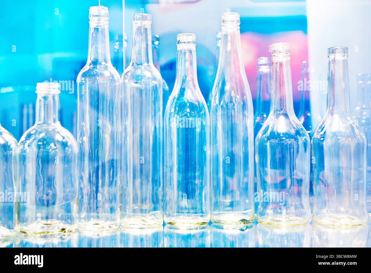 Empty bottles for alcoholic drinks at a shop window Stock Photo - Alamy