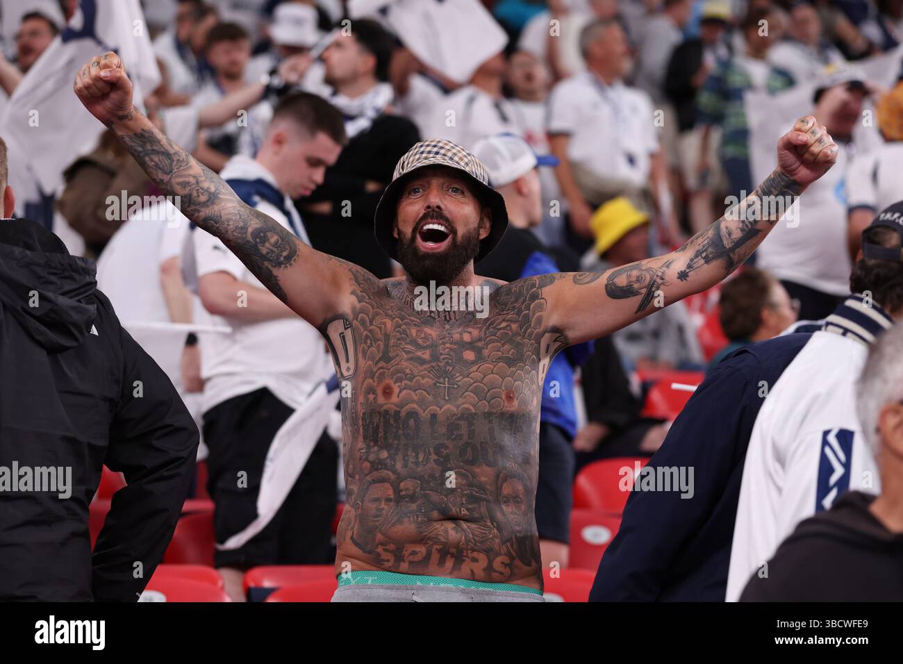 Bilbao, Spain. 21st May, 2025. A Tottenham fan with tattoos covering ...