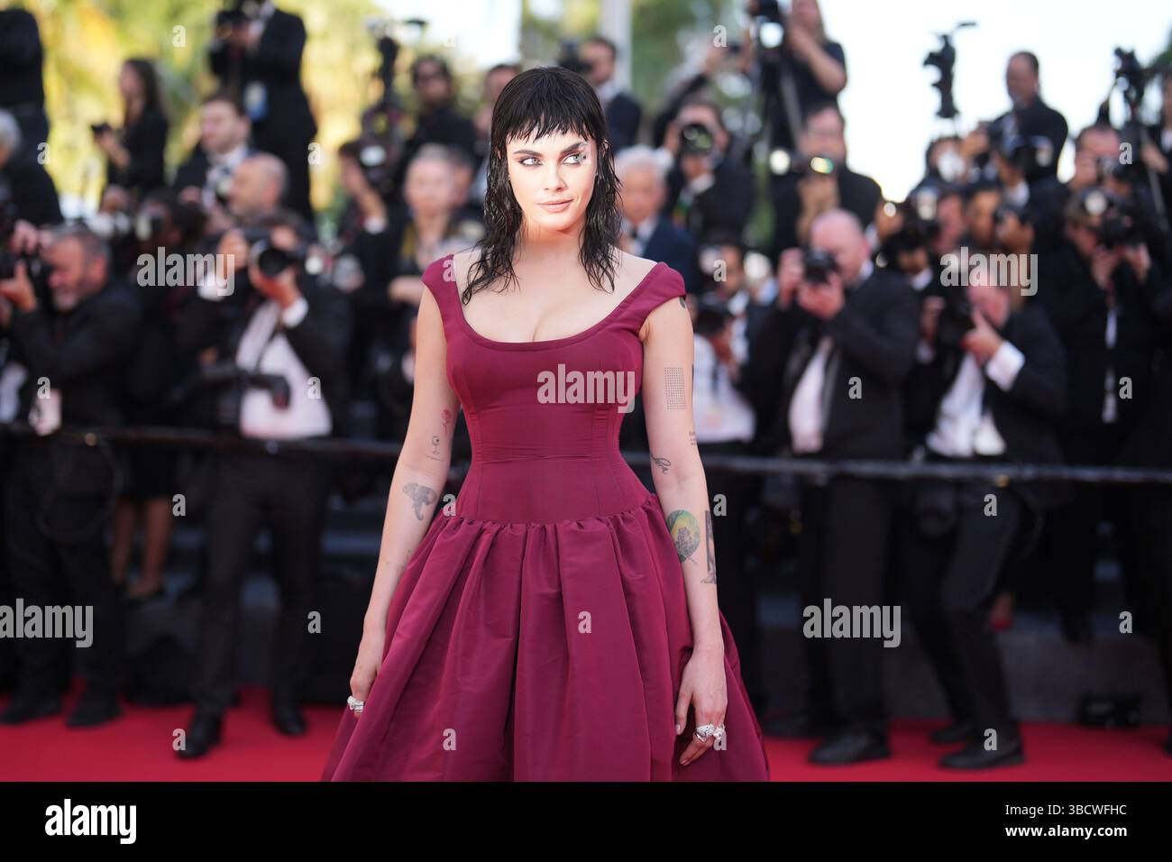 Cara Delevingne poses for photographers upon arrival at the premiere of ...