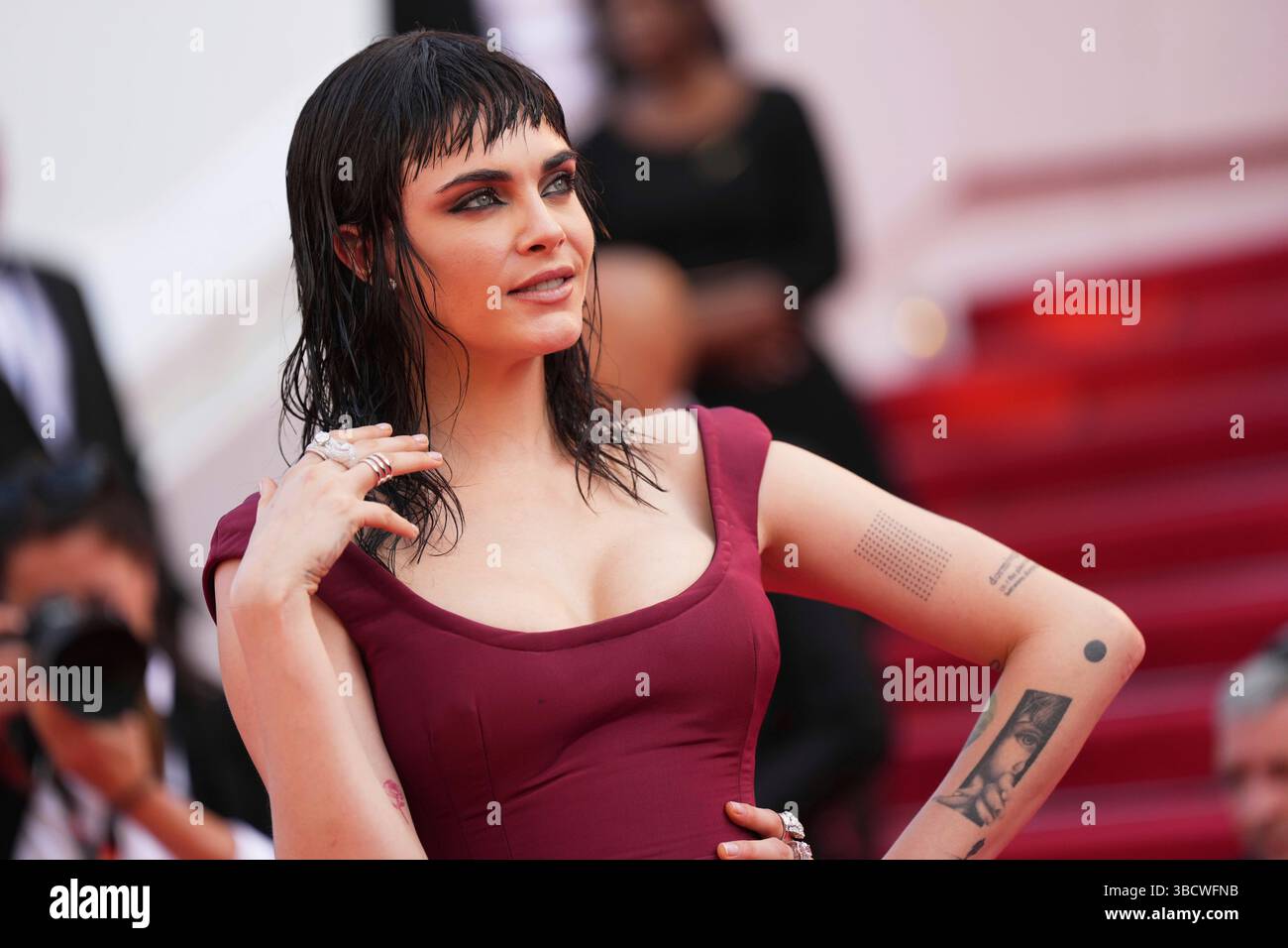 Cara Delevingne poses for photographers upon arrival at the premiere of ...