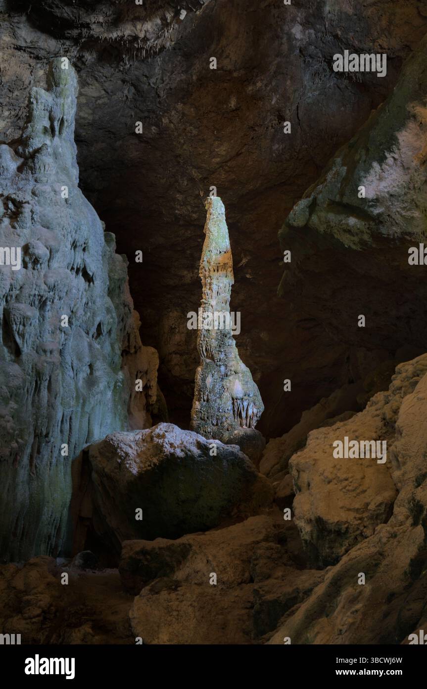 Dramatic scene inside a cave in Spain, featuring a prominent stalagmite ...
