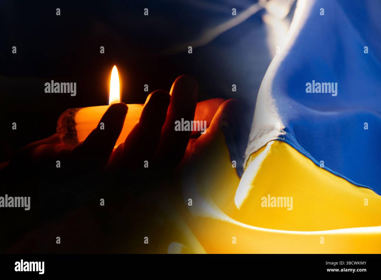 Candle in hand against the background of the Ukrainian flag, peace and ...