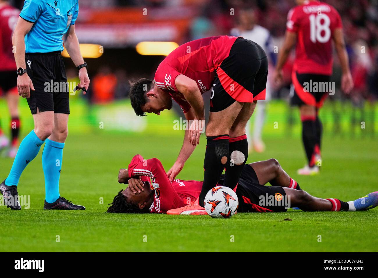 Manchester United's Patrick Dorgu reacts on the ground during the ...