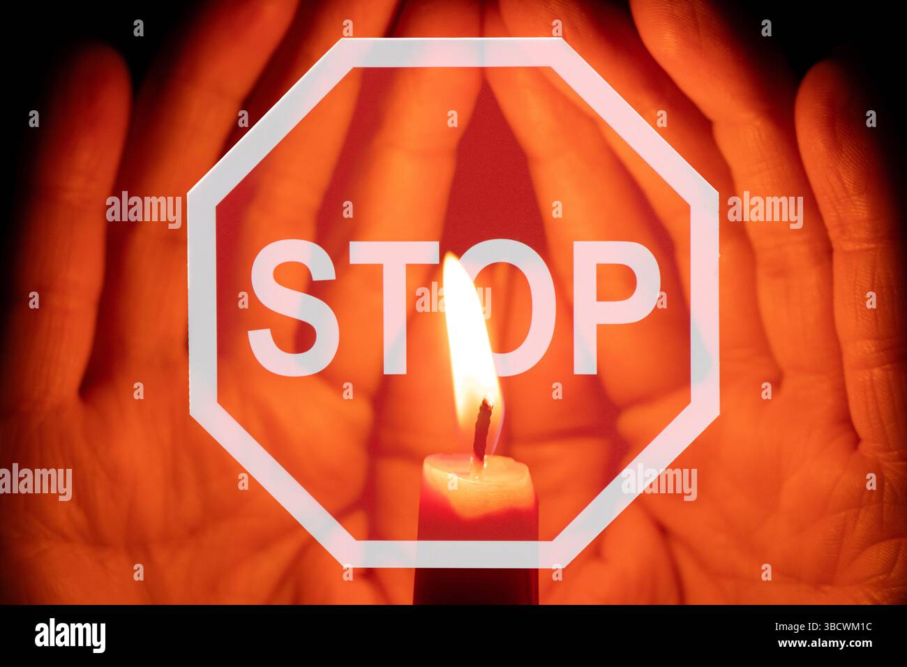 Stop violence, female hands holding a candle and a stop sign, prayer ...