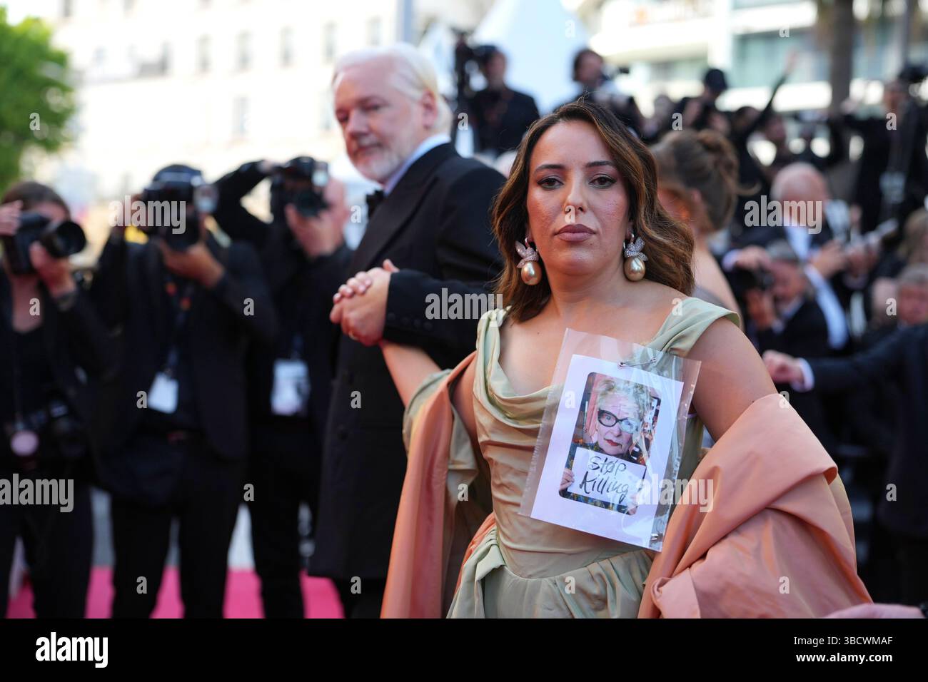 Julian Assange, left, and Stella Assange pose for photographers upon ...
