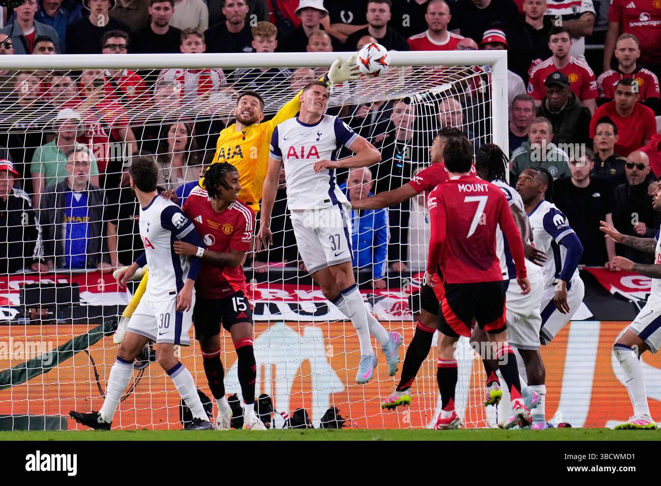 Tottenham's Micky van de Ven fights for the ball with Tottenham's ...
