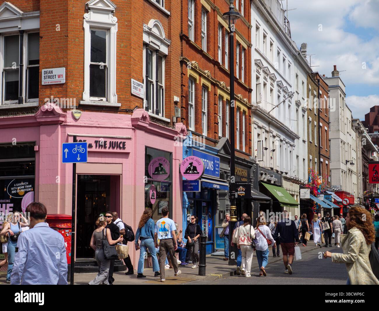 Busy crowded Old Compton Street full of people walking, Soho, West End ...
