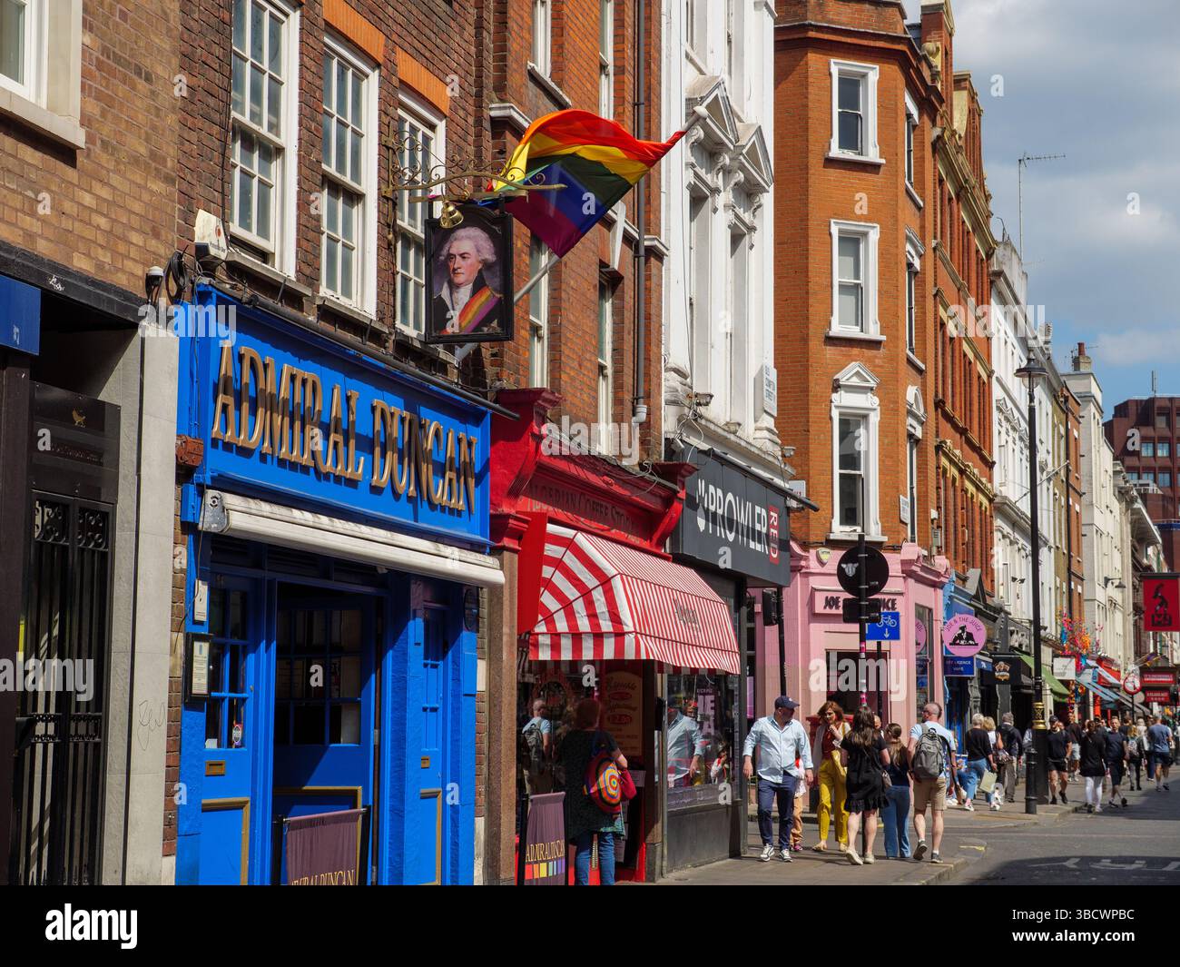 People walking along Old Compton Street, Soho, West End, Westminster ...