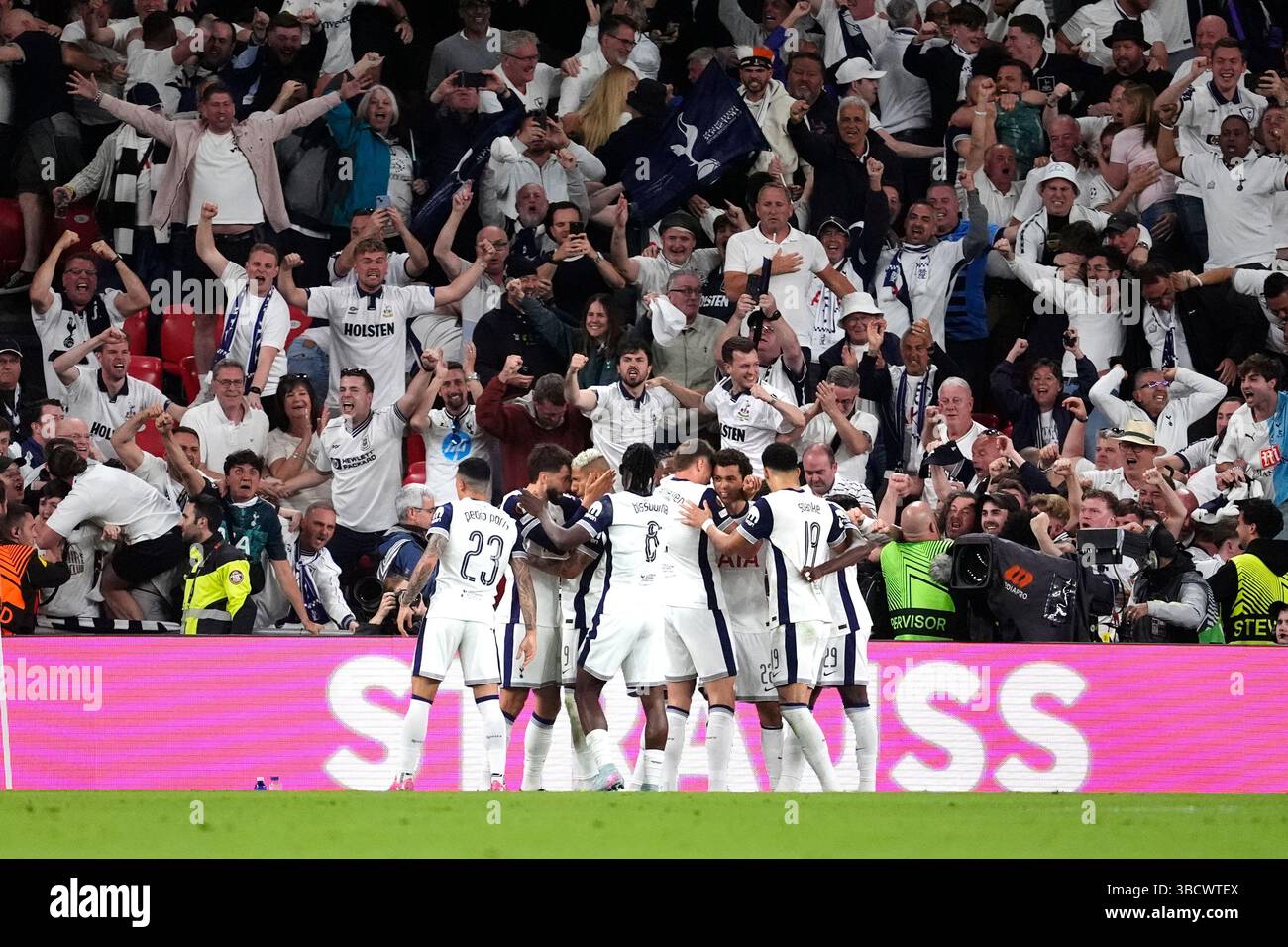 Tottenham Hotspurs fans celebrate their side's first goal of the game ...