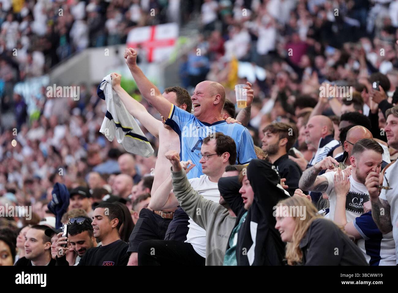 Tottenham Hotspur fans celebrates their side's first goal of the game ...