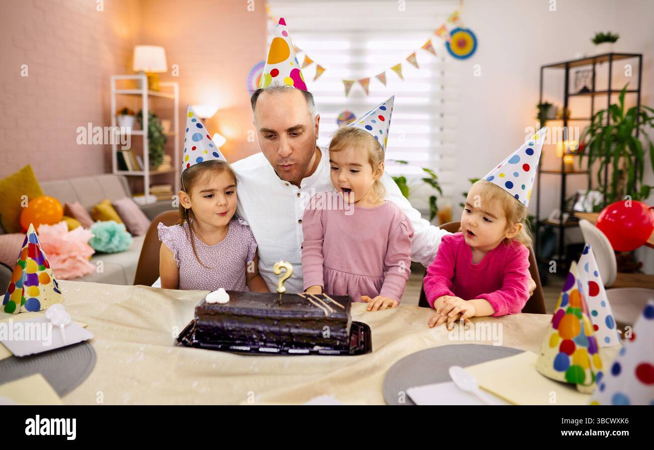 Celebrating a joyful birthday party with cake and laughter Stock Photo ...