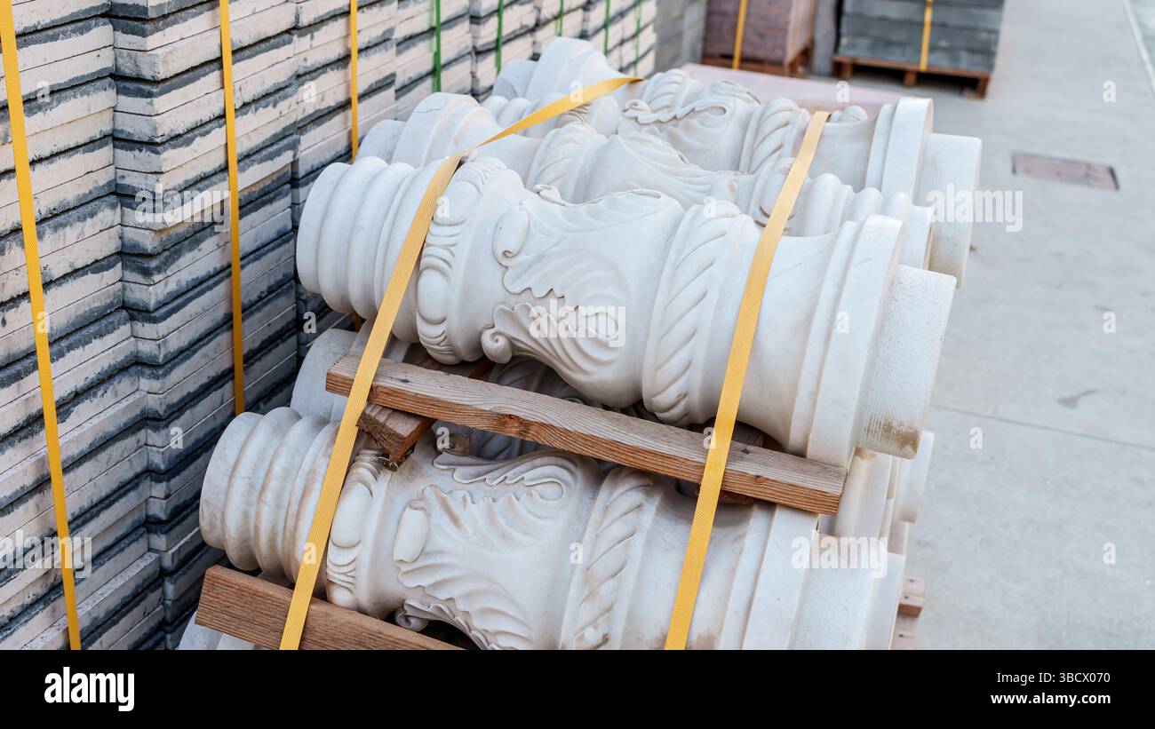 Pallets with stacked gray paving slabs selective focus Stack of paving ...