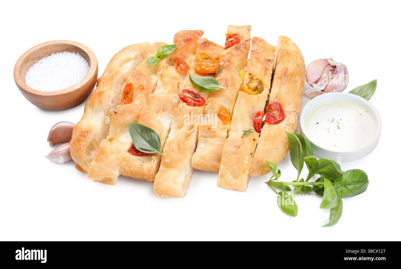 Cut delicious focaccia with tomatoes, spices and oil isolated on white ...