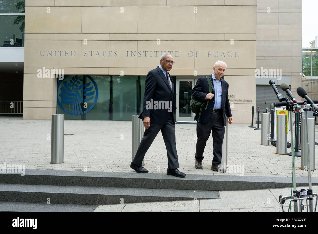 U.S. Institute of Peace (USIP) acting President George Moose, left, and ...