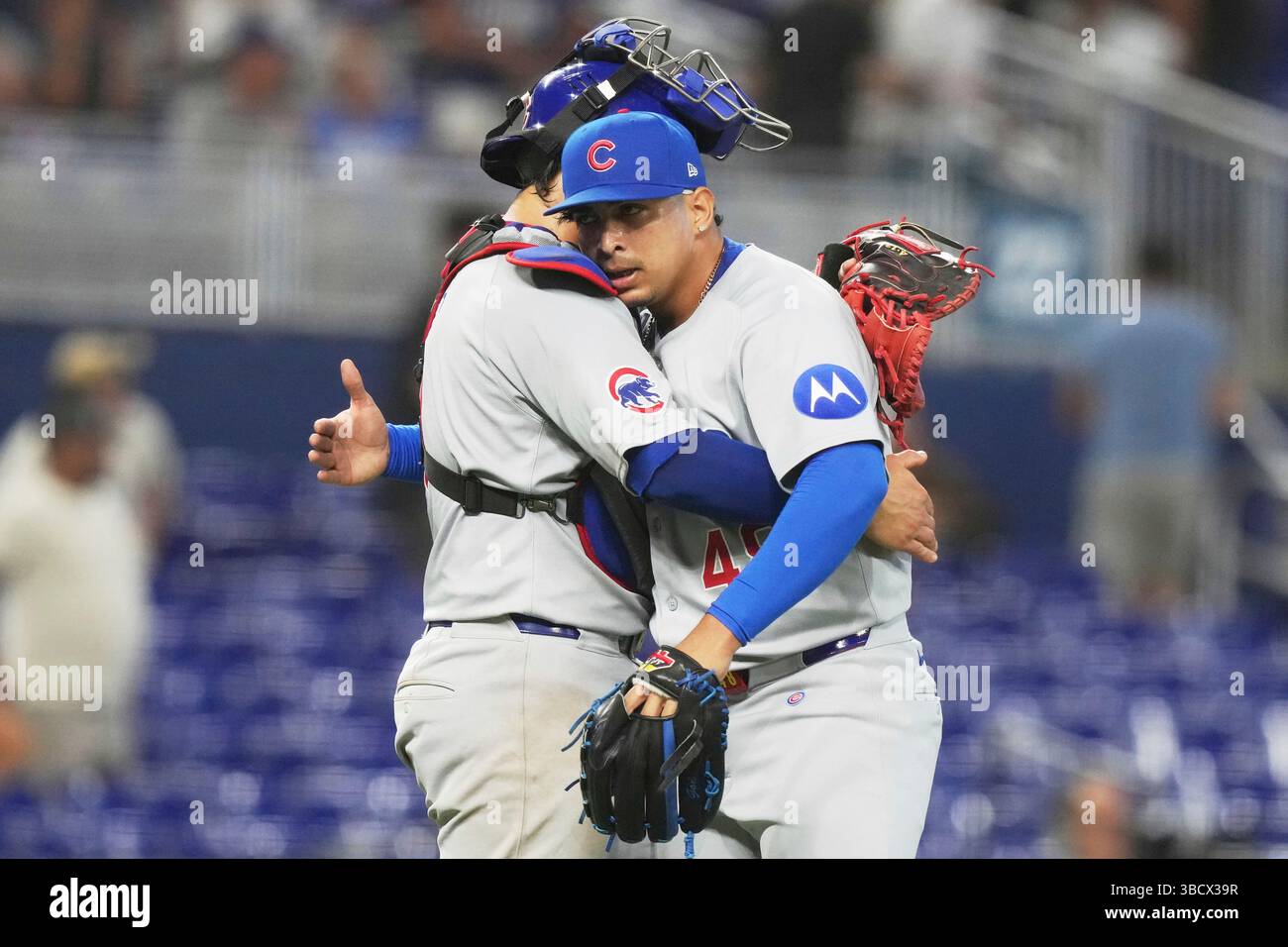 Chicago Cubs relief pitcher Daniel Palencia, right, embraces catcher ...