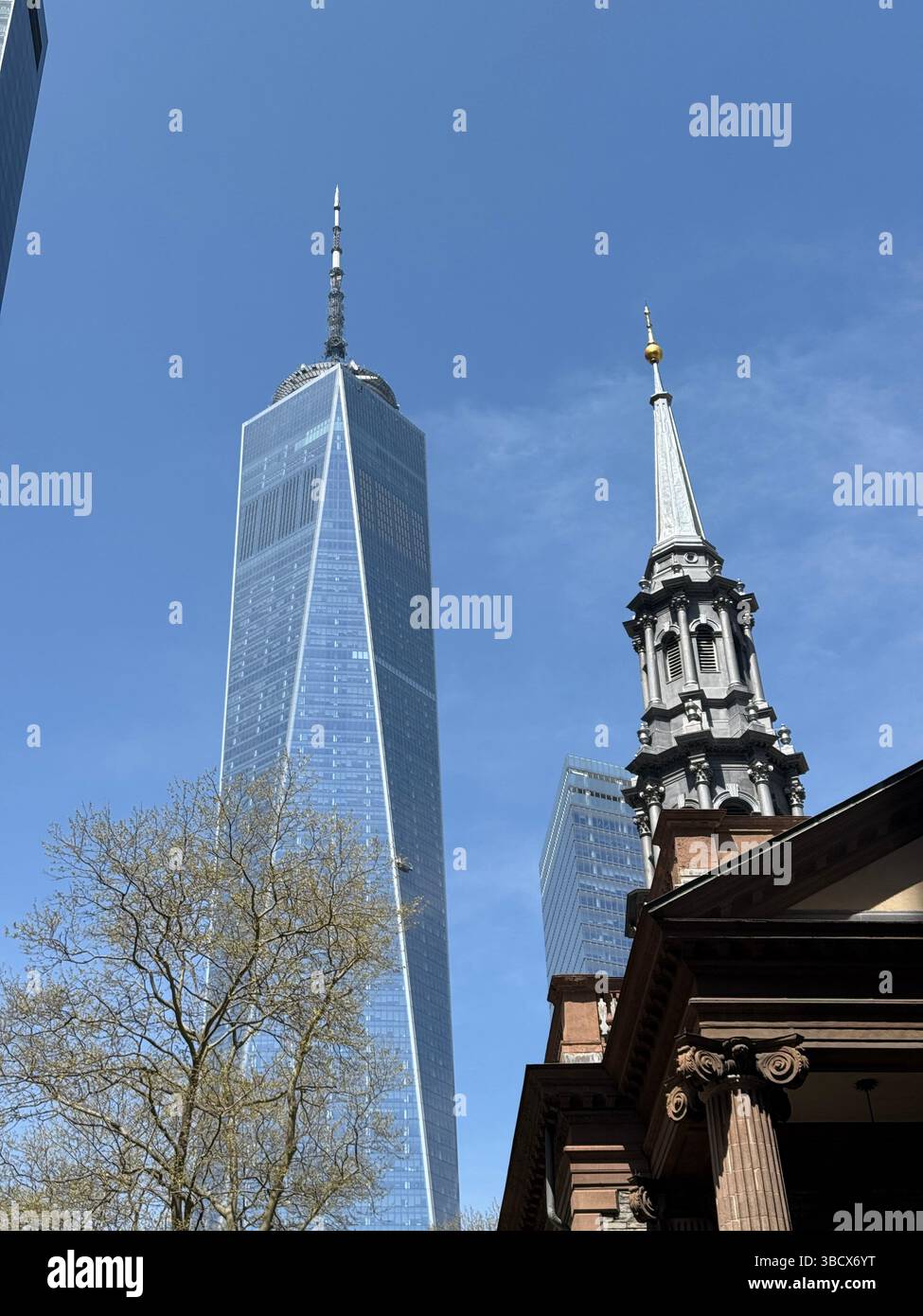 Trinity Church steeple and World Trade Center tower both reaching to ...