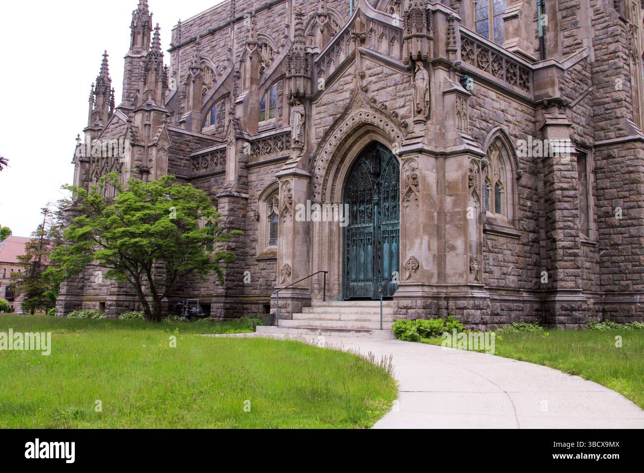 A stone church crafted in Gothic castle style. Its fortified walls ...